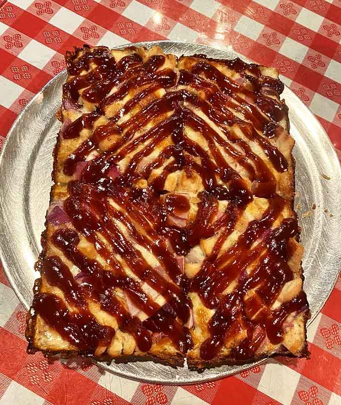 BBQ chicken pizza with its sweet-tangy sauce drizzle proves that Cloverleaf knows tradition but isn't afraid of a delicious flavor adventure.
