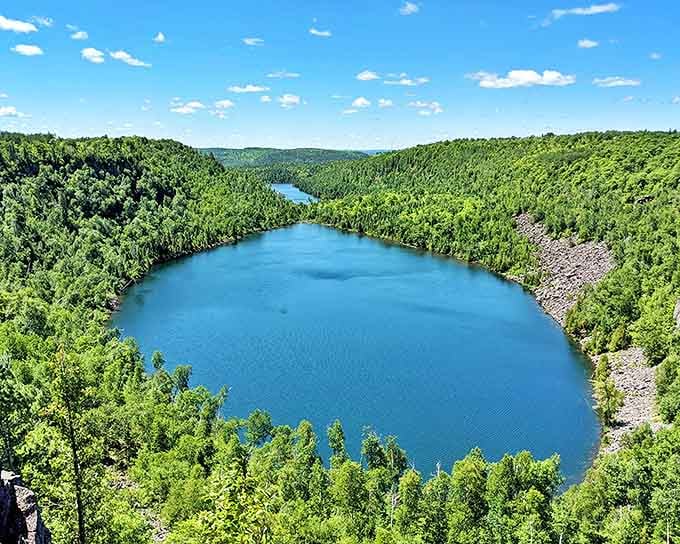 Twin jewels nestled in forest green: Bean and Bear Lakes shimmer like sapphires in a verdant setting, rewarding hikers who brave the challenging trail.