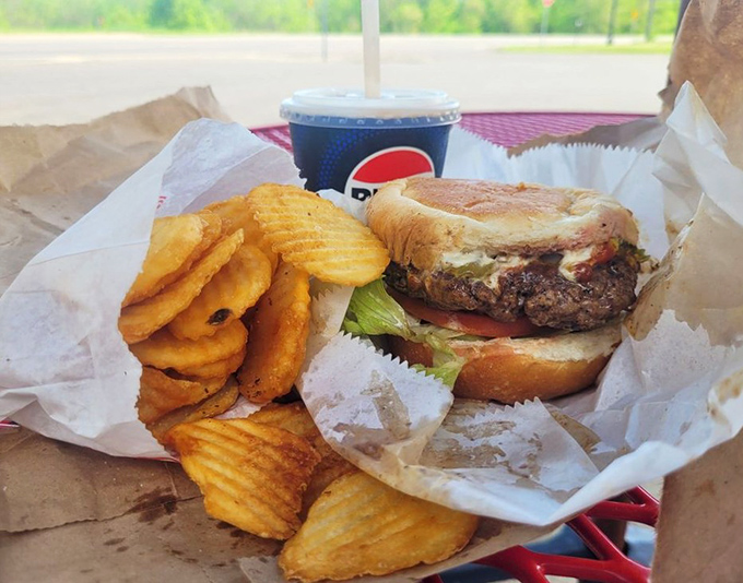 The classic burger basket &ndash; complete with ridged potato chips and a cold Pepsi &ndash; represents American drive-in cuisine at its finest.