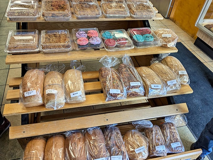 Display rack filled with temptation &ndash; where diet plans go to die and happiness is measured in pastry selection.