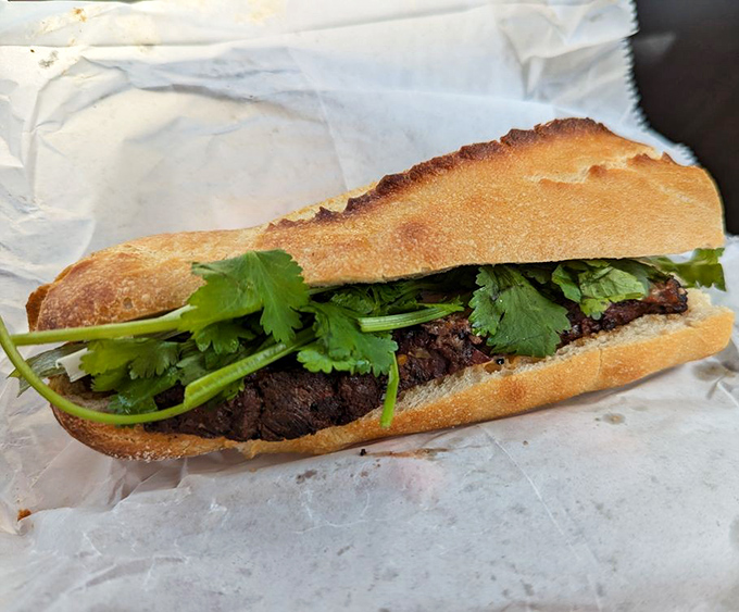 The brisket b&aacute;nh m&igrave; represents culinary diplomacy at its finest &ndash; smoky American barbecue meeting Vietnamese tradition in one perfect sandwich.