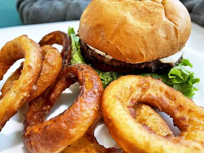 This isn't just a burger with onion rings &ndash; it's a tower of power that makes vegetables and protein shake hands and become best friends.