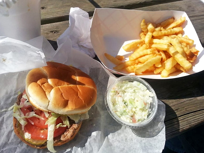 The quintessential drive-in meal: a perfectly dressed burger, golden fries, and fresh coleslaw that puts fast food chains to shame.