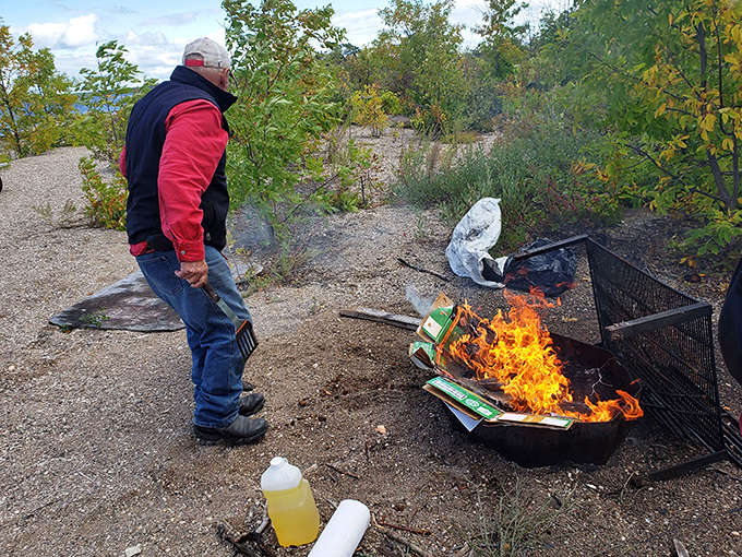 Flames dance in a shoreline fire pit, transforming ordinary evenings into magical memories under Minnesota's vast sky.