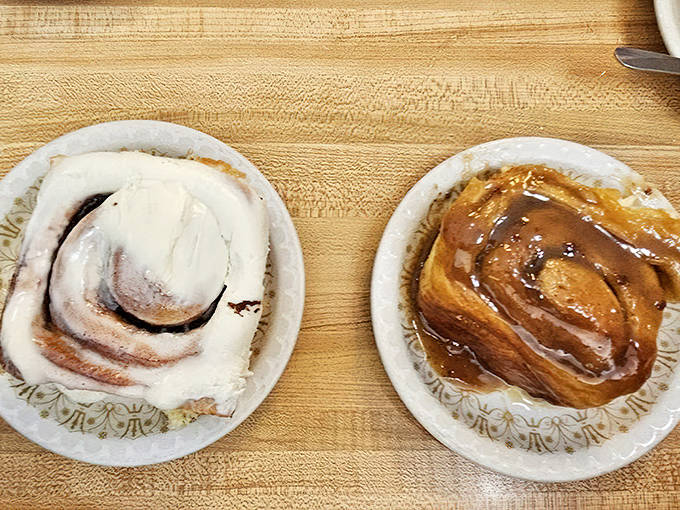 Sweet decisions: the classic cinnamon roll with cream cheese frosting alongside its caramel-drenched sibling &ndash; both worth every calorie.