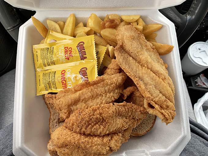Golden catfish with all the fixings, proving that Pryor's mastery extends beyond the smoker to the fryer.