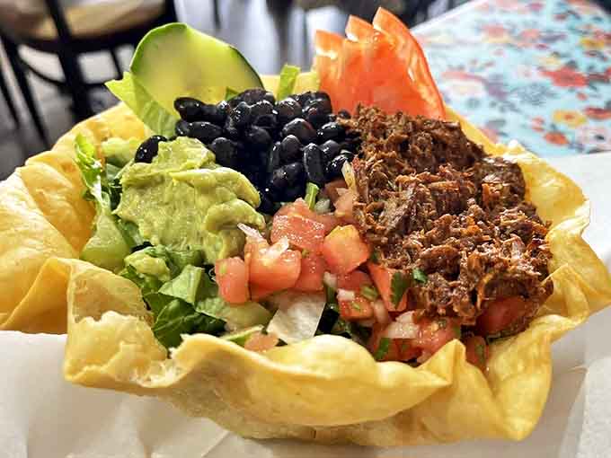 The taco salad comes in its own edible bowl &ndash; a crunchy tortilla fortress protecting a treasure of fresh ingredients and seasoned meat.