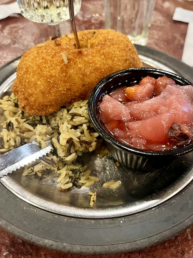 Golden-brown and hiding a buttery secret inside, the chicken Kiev arrives like a delicious time capsule from the era when calories weren't counted.
