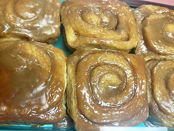 These glistening spirals of buttery, spiced dough aren't just pastries &ndash; they're edible hugs waiting to brighten your morning.