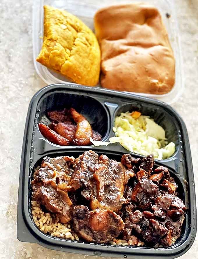 A feast fit for royalty &ndash; oxtail, rice and peas, plantains, and cabbage create a harmony of flavors that sing of Jamaica's culinary heritage.