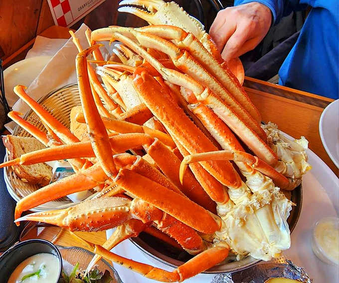Snow crab legs arranged like a sculptural centerpiece &ndash; a delicious puzzle that rewards those willing to work for their dinner.