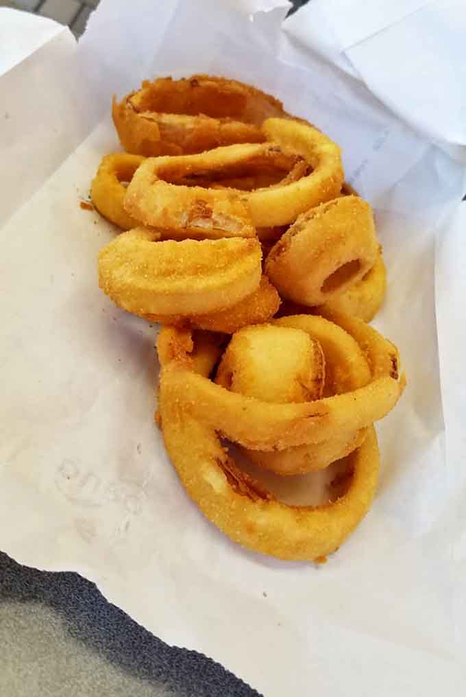 These onion rings achieved that elusive golden perfection where the coating stays put and the onion stays tender&mdash;a rare accomplishment indeed.