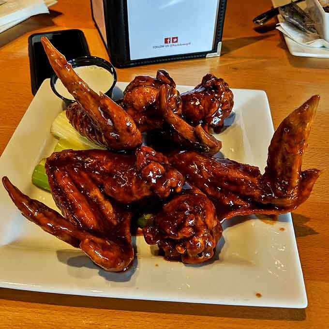 The Drunken Wings glisten with their bourbon-infused glaze &ndash; a sweet-heat combination that might just be habit-forming.