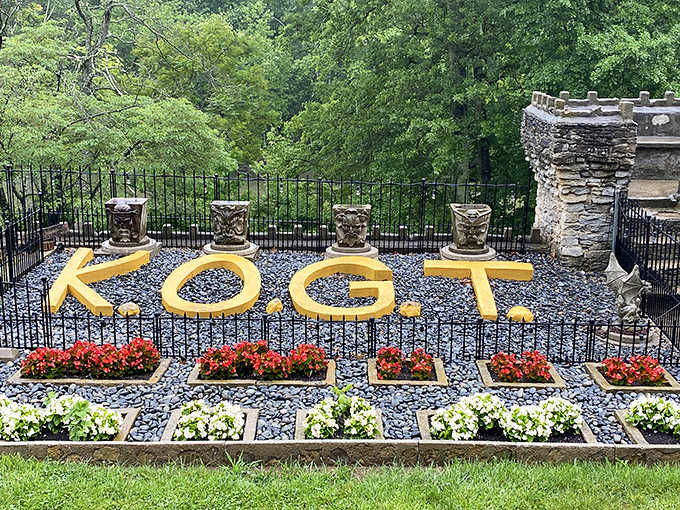 KOGT spelled in flowers pays homage to the Knights of the Golden Trail, the castle's dedicated modern guardians.