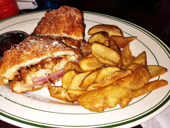 The Monte Cristo sandwich &ndash; a sweet-savory masterpiece of ham and cheese in crispy fried bread with perfectly golden potato wedges.