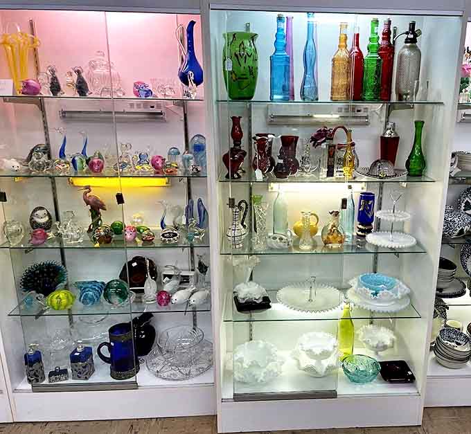 Light dances through colored glass treasures—each bottle and vase capturing light in ways that mass-produced items simply cannot match.