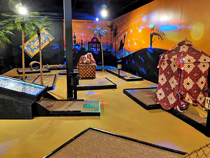 Ancient Egypt gets the neon treatment with pyramids and palm trees that would make King Tut trade his gold for glow sticks.