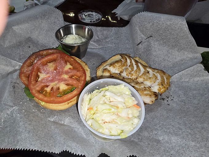 A Keys classic done right &ndash; fresh-caught grouper nestled on a soft bun with crisp veggies and house-made slaw.