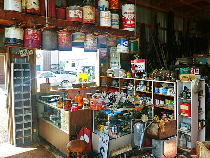 The rustic interior stretches deep, revealing layer after layer of antique discoveries and vintage finds.