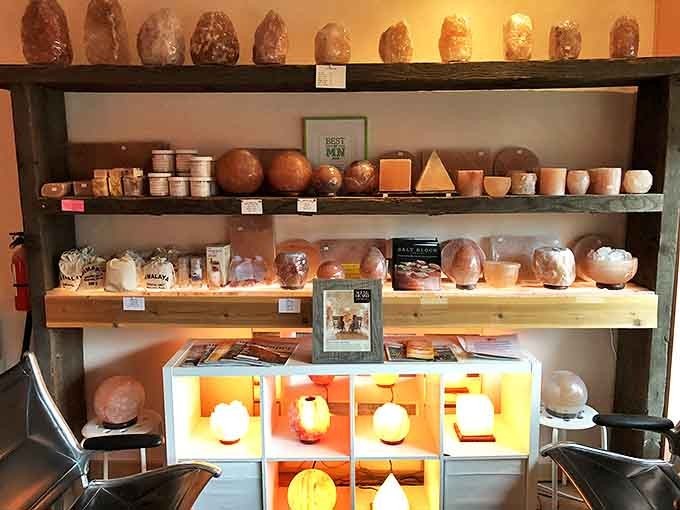 A treasure trove of Himalayan salt products glows under soft lighting, tempting visitors to bring the cave experience home.