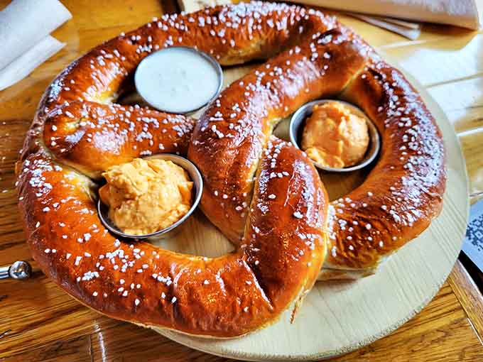 This isn't your average ballpark pretzel&mdash;it's a show-stopping behemoth that arrives hanging dramatically, ready for communal tearing and dipping.