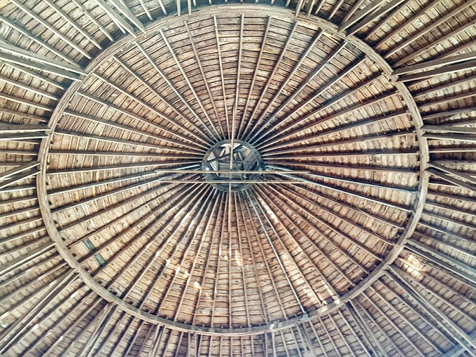 Look up! The intricate wooden ceiling radiates from the center like sunbeams, a masterclass in timber engineering without modern tools.
