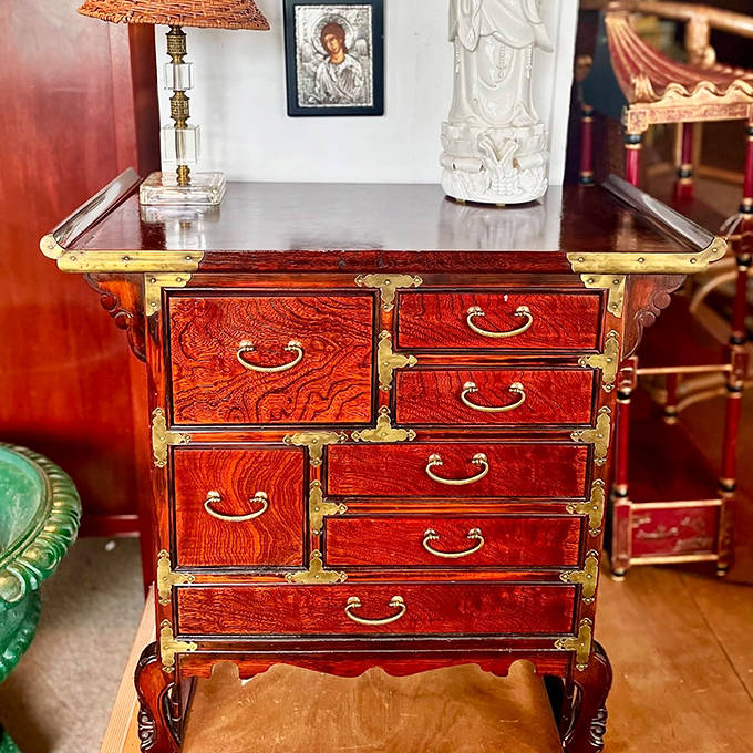This Japanese-style tansu chest with its rich wood grain and brass hardware whispers tales of ocean voyages and hidden compartments.