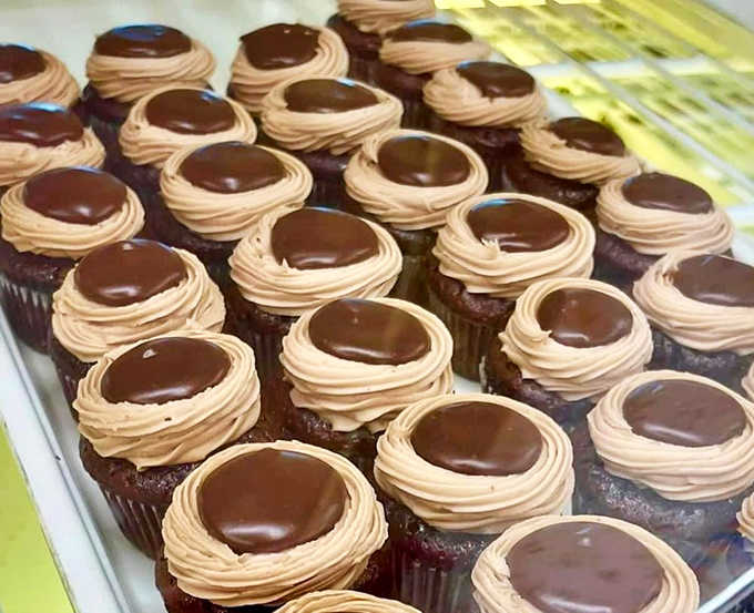 These chocolate masterpieces topped with colorful icing flowers aren't just desserts &ndash; they're edible art that somehow taste even better than they look.