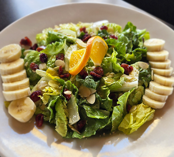 This vibrant salad proves the kitchen's range extends beyond pickles, with fresh ingredients arranged like an edible work of art.
