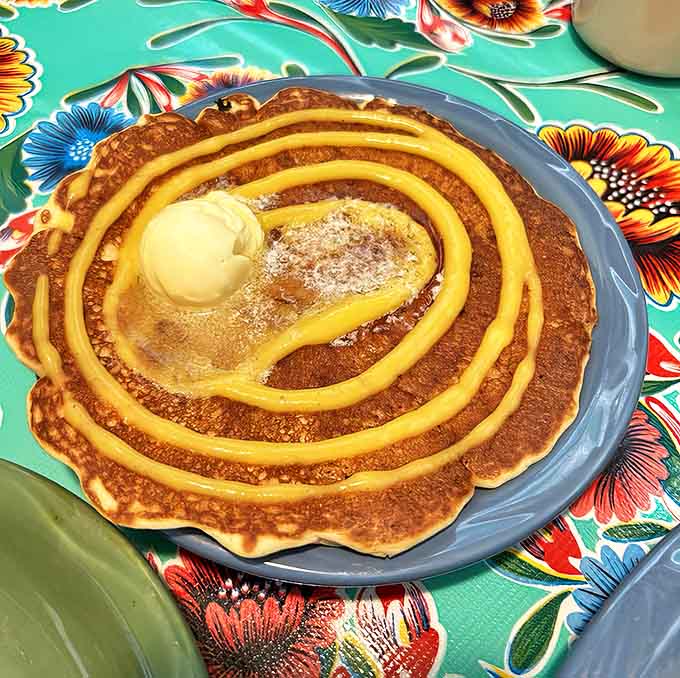 Breakfast reimagined: This mango pancake with honey swirls and a dollop of butter is sunshine on a plate.