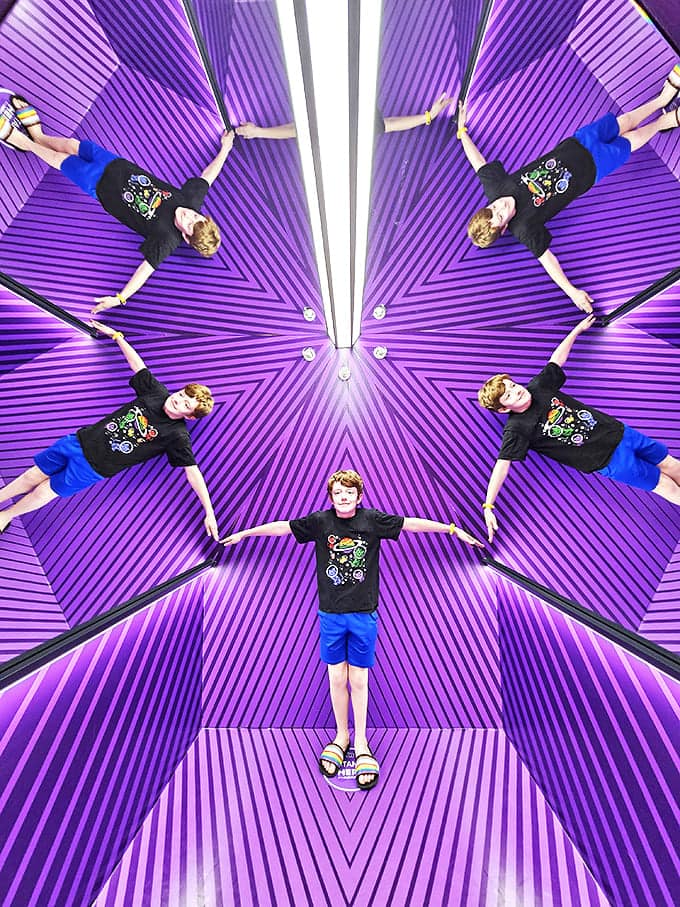 A psychedelic wonderland of infinite reflections transforms visitors into kaleidoscopic patterns. Prepare for your Instagram feed to explode!