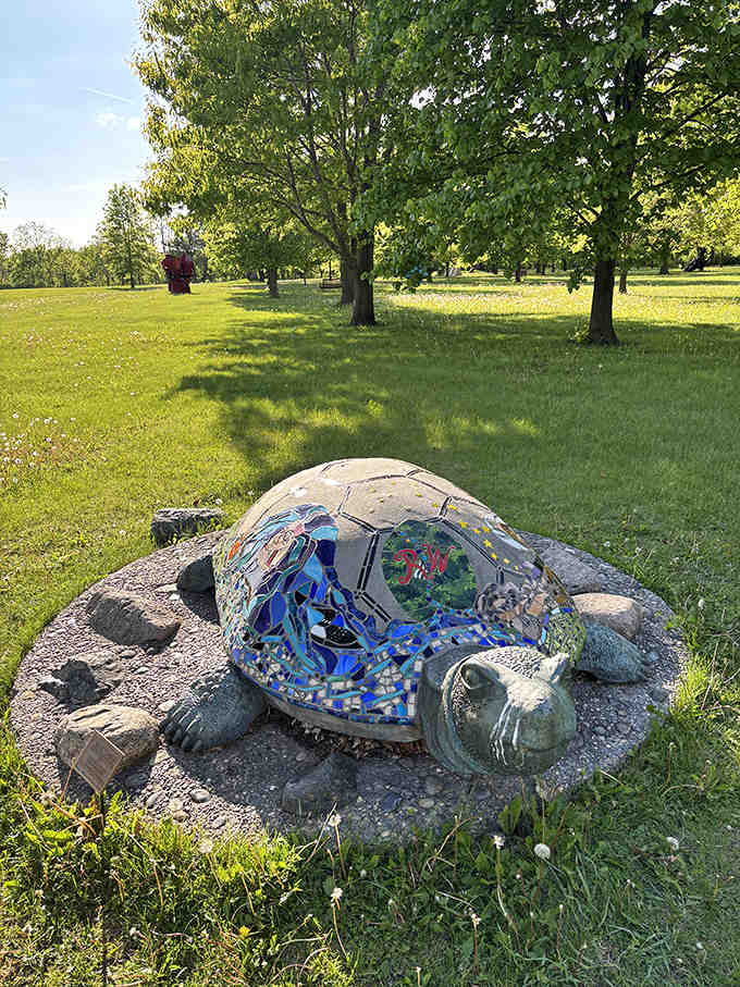 A mosaic turtle basks permanently in Minnesota sunshine, its colorful shell a kaleidoscope of tiny tiles that children can't resist approaching.