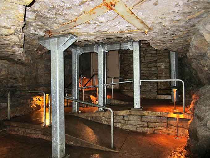 Industrial chic, nature style: Metal walkways and strategic lighting transform this ancient cavern into an accessible underground adventure.