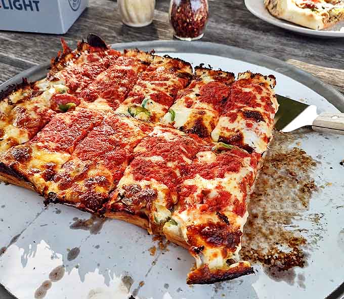 Detroit-style pizza with edges so perfectly caramelized, you'll fight your dining companions for the corner pieces. Worth every calorie.