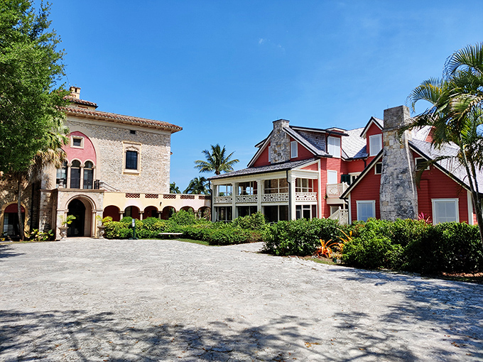 The estate's grand interior space transforms from historic hall to cultural canvas, where checkered floors anchor soaring white ceilings.