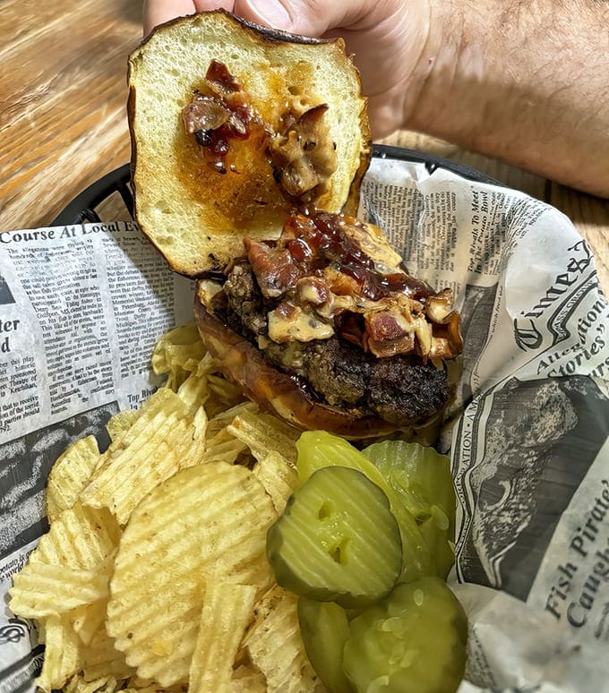 Peanut butter, bacon, and habanero jelly on a burger? It sounds like a dare but tastes like a revelation. Culinary courage rewarded.