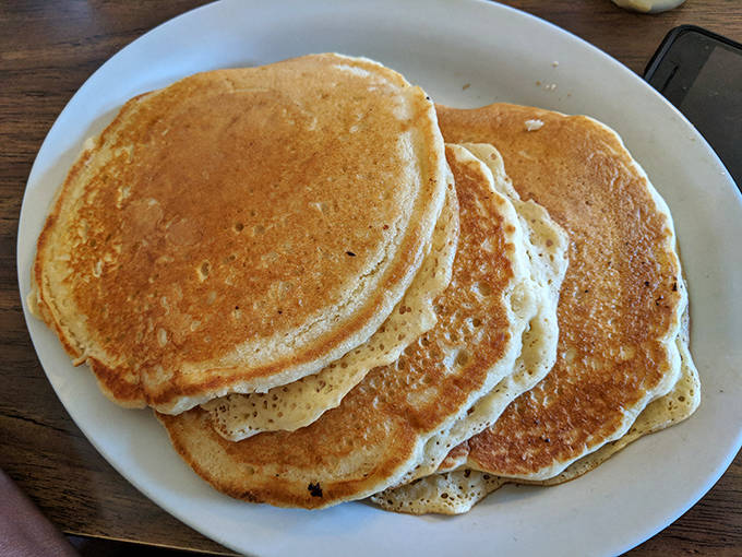 Golden-brown pancakes stacked high enough to cast their own shadow &ndash; these fluffy discs of joy are worth setting the alarm for.