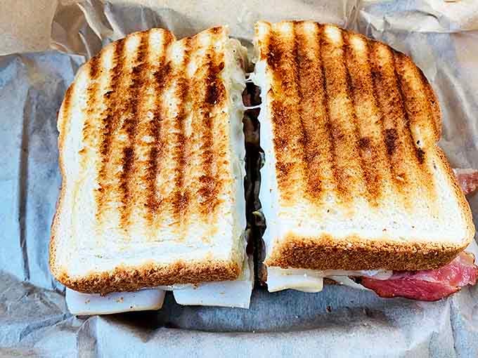 This isn't just a sandwich; it's architecture between bread slices &ndash; perfectly grilled with cheese pulling that Instagram-worthy stretch with every bite.