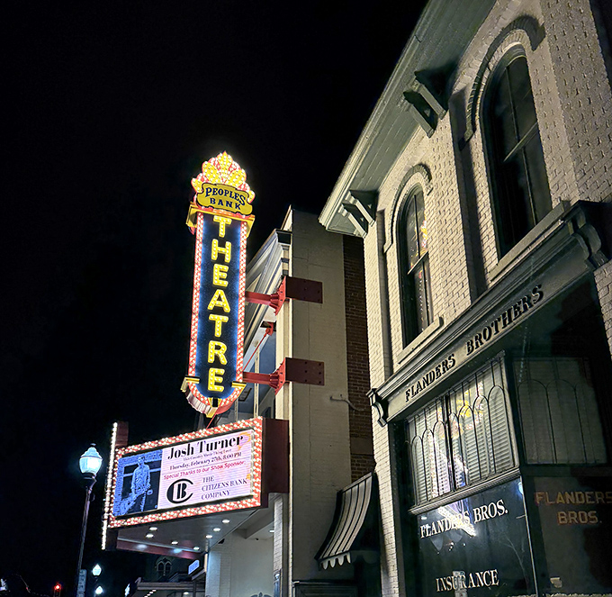 The Peoples Bank Theatre's vintage marquee lights up downtown evenings, promising entertainment in a setting where every seat feels like the best in the house.