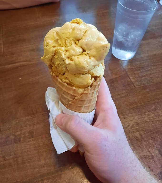 Wisconsin's dairy legacy in a cone &ndash; butter pecan ice cream scooped generously, ready to challenge your notion of what ice cream should be.