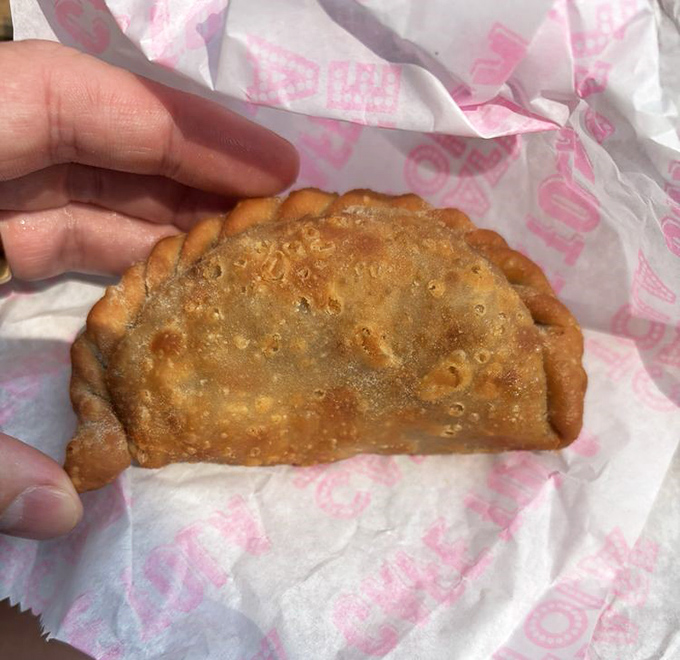 One bite reveals the magic inside &ndash; this Rajas empanada combines potatoes and cheese in a dance of textures that'll make your taste buds swoon.