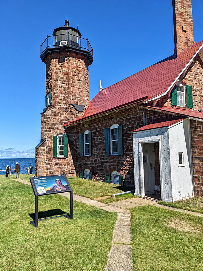 Sand Island Lighthouse stands sentinel against Superior's moods, its weathered stone walls telling tales of storms weathered and ships guided safely home.