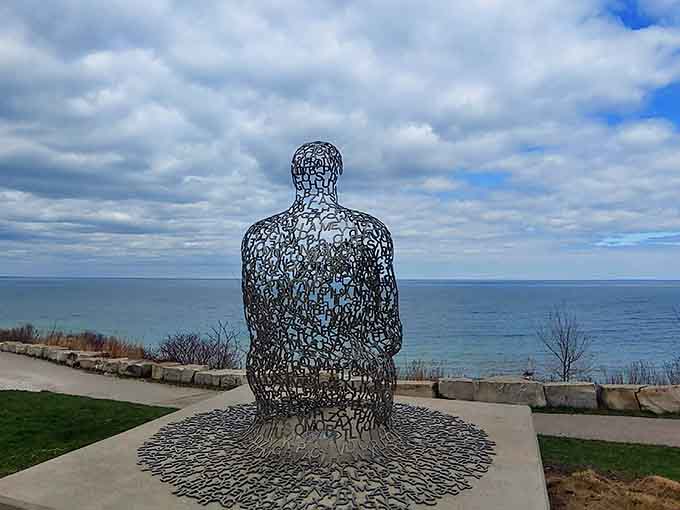 "Spillover II" contemplates Lake Michigan's vastness, a silent metal observer that's become Shorewood's most photographed resident.