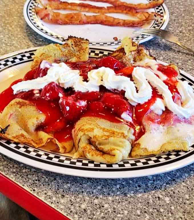 These strawberry crepes arrive looking like dessert masquerading as breakfast &ndash; sweet, indulgent, and worth every calorie.