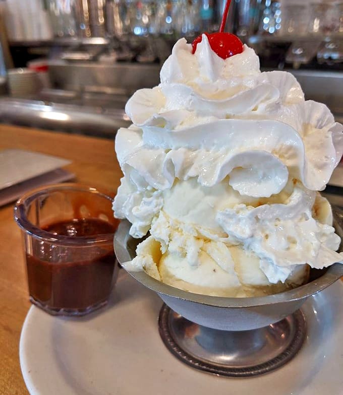 This isn't just a sundae &ndash; it's architecture in edible form, a towering achievement of cream, fudge, and childhood dreams.