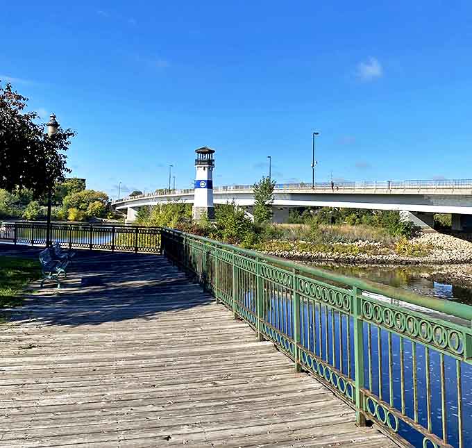The boardwalk offers perfect viewing angles of this charming maritime beacon, inviting visitors to slow down and enjoy the river views.