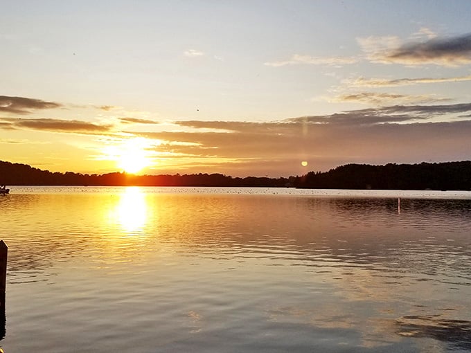 Sunset transforms the lake into liquid gold, creating the kind of moment that makes you forget to check your phone.