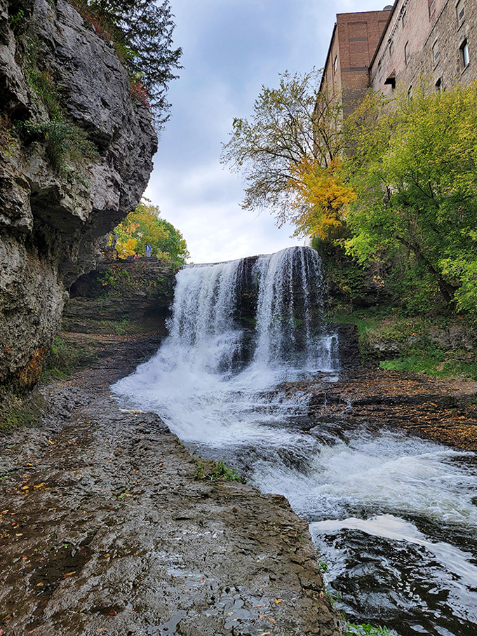 The waterfall doesn't just fall&mdash;it performs, cascading dramatically against ancient stone walls that have witnessed centuries pass.