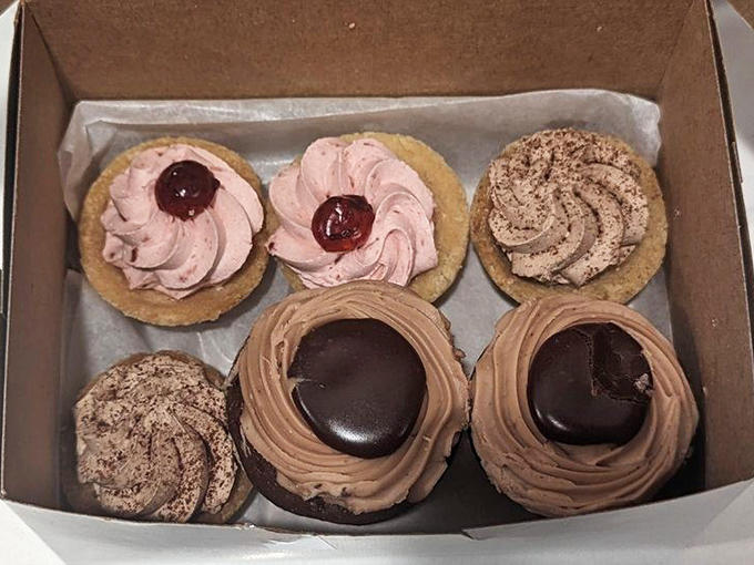 Delicate tarts arranged with surgical precision showcase the fine line between pastry chef and artist.