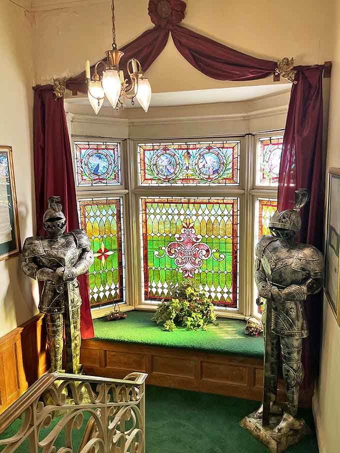 Stained glass windows and suits of armor standing guard: because regular windows and regular security are for regular buildings, not castles.